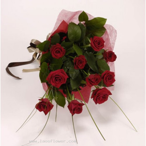 A bouquet of 10 red roses wrapped with red paper and tied with ribbon.